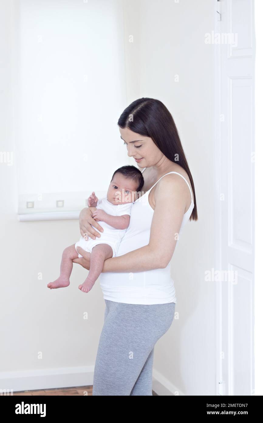 Mother carrying baby girl Stock Photo - Alamy Mother carrying baby girl Stock Photo - Alamy
