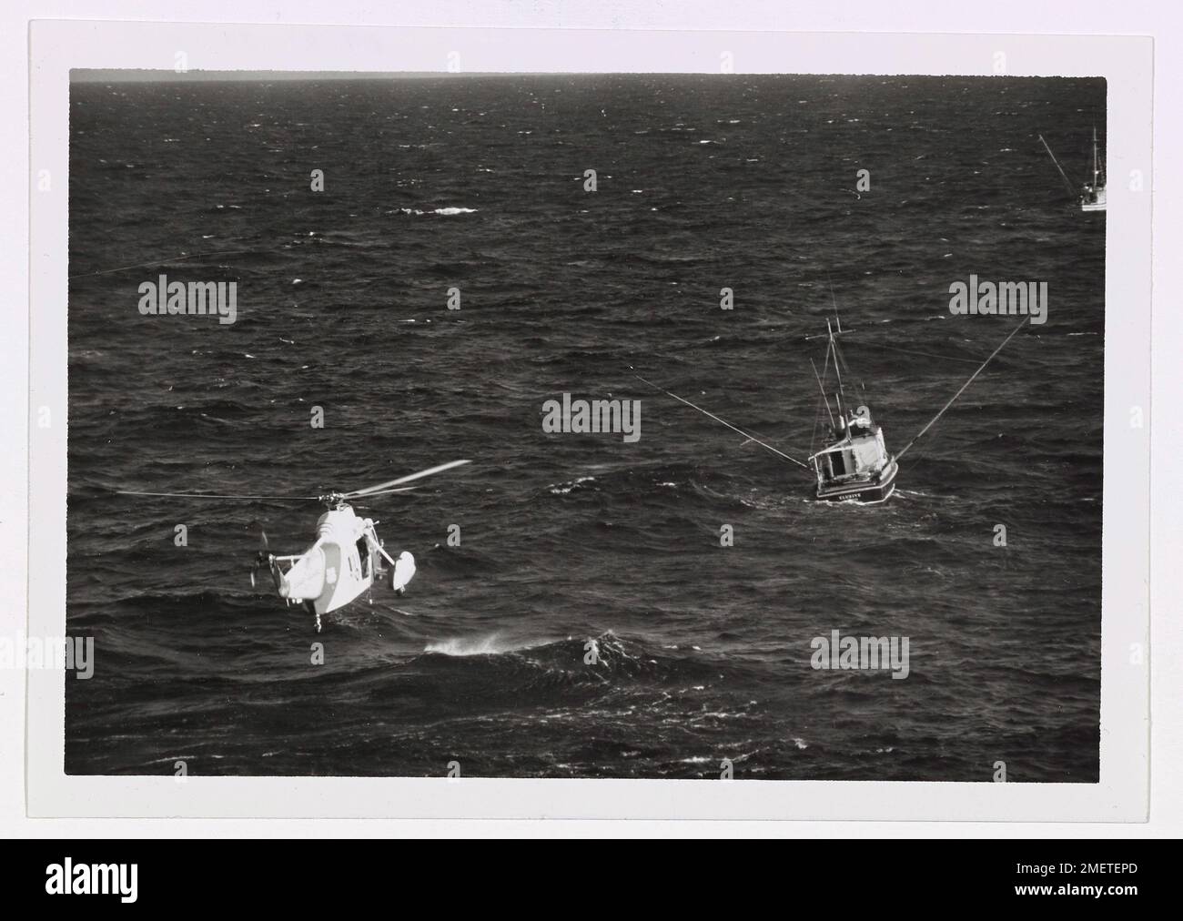 A U.S. Coast Guard helicopter, piloted by Lieutenant Commander Roger ...