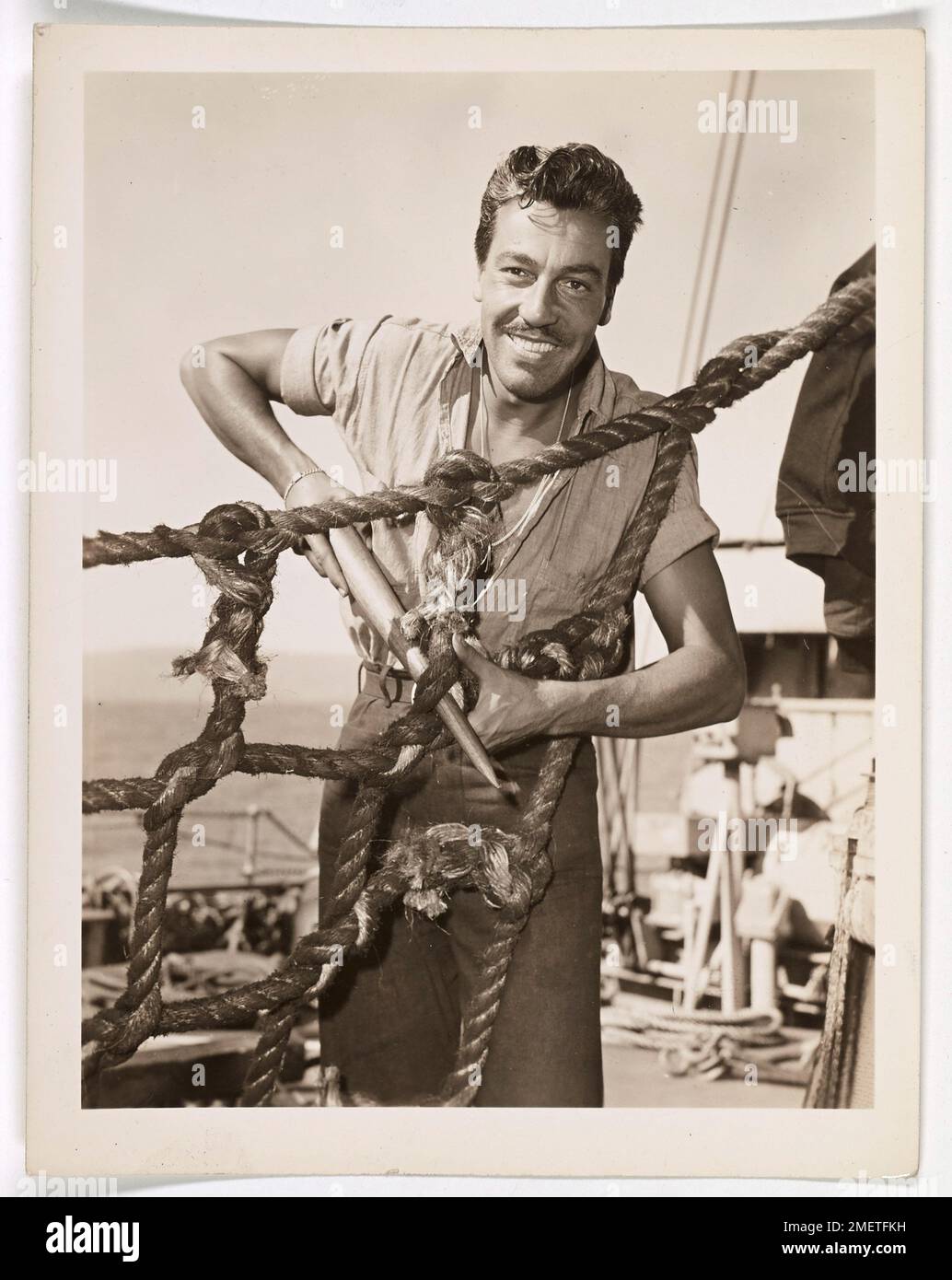 Cesar Romero, the actor, is photographed aboard a Coast Guard-manned ...