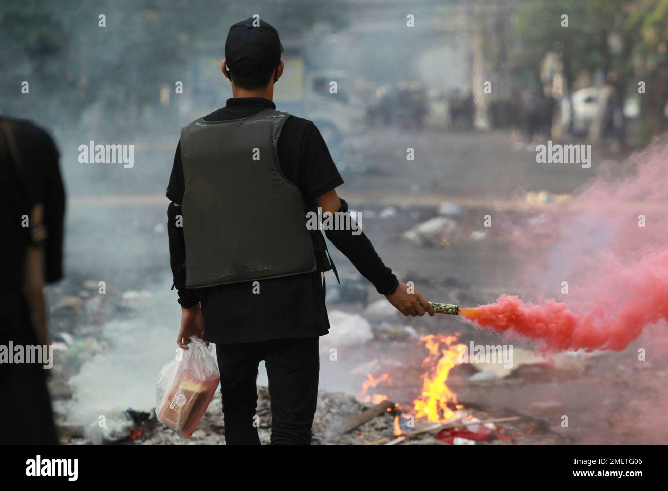 Anti-coup demonstrators prepare to confront police during a protest in ...