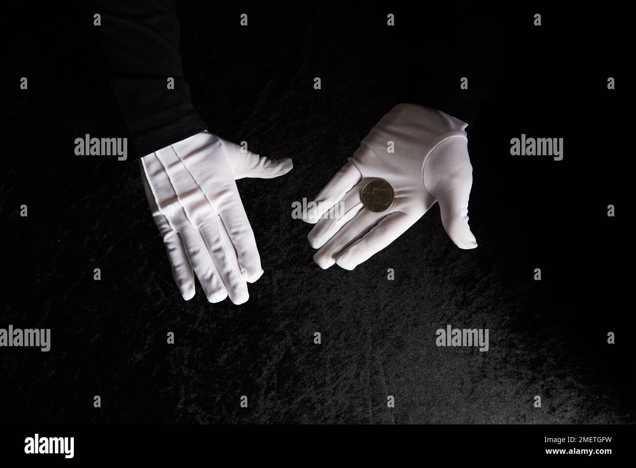 Magician performing trick using coin Stock Photo - Alamy Magician performing trick using coin Stock Photo - Alamy