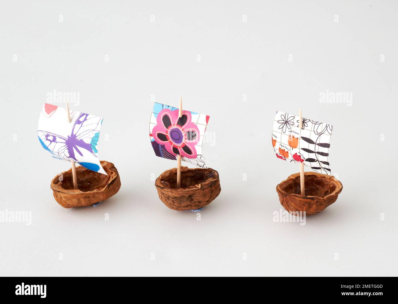 Walnut shells boats Stock Photo - Alamy