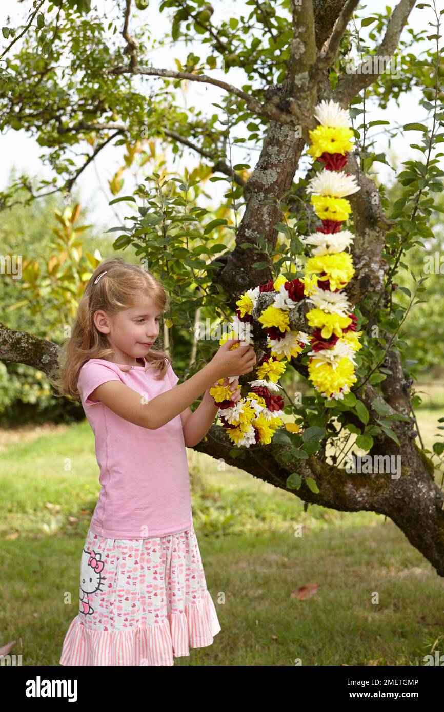 Making flower garland Stock Photo - Alamy