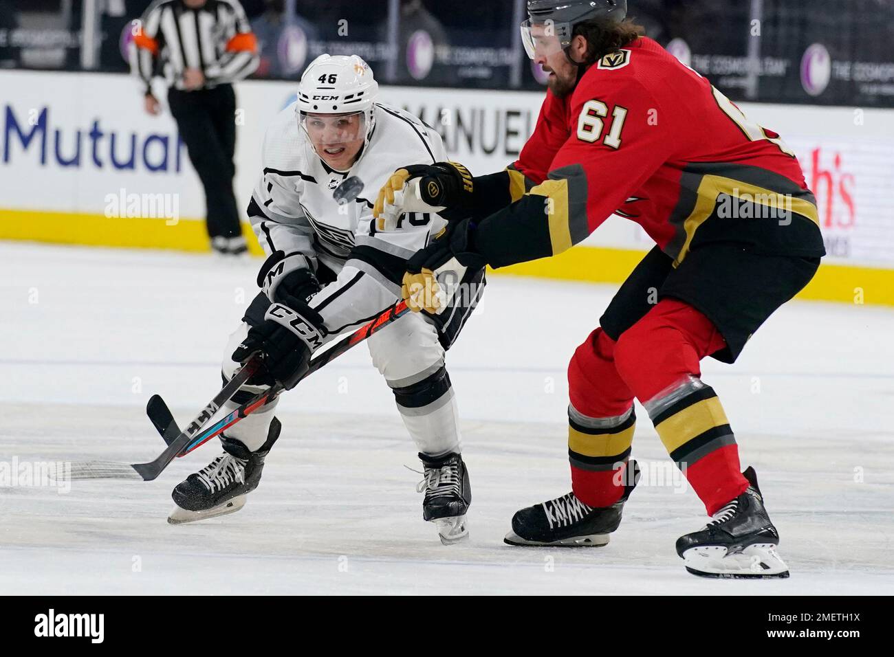 Los Angeles Kings center Blake Lizotte (46) knocks the puck up the ice ...