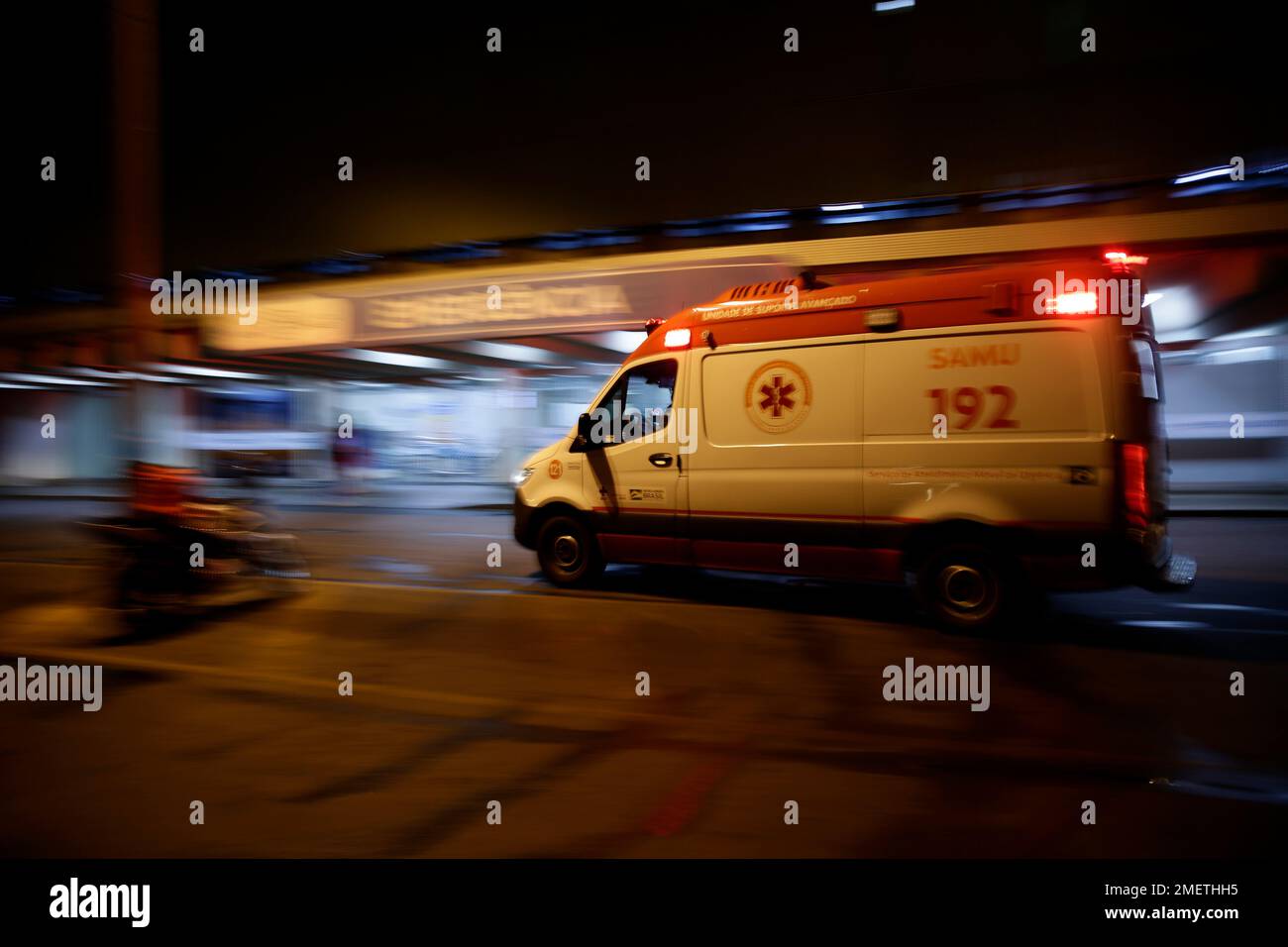 An ambulance of the public Mobile Emergency Service rushes with a ...