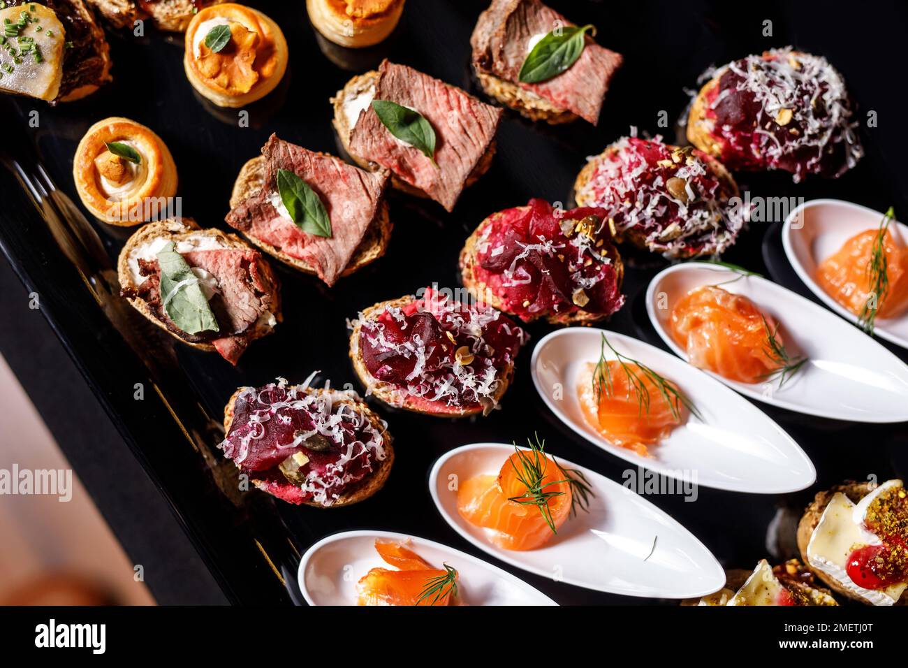 Catering plate. Assortment of snacks on the buffet table Stock Photo ...