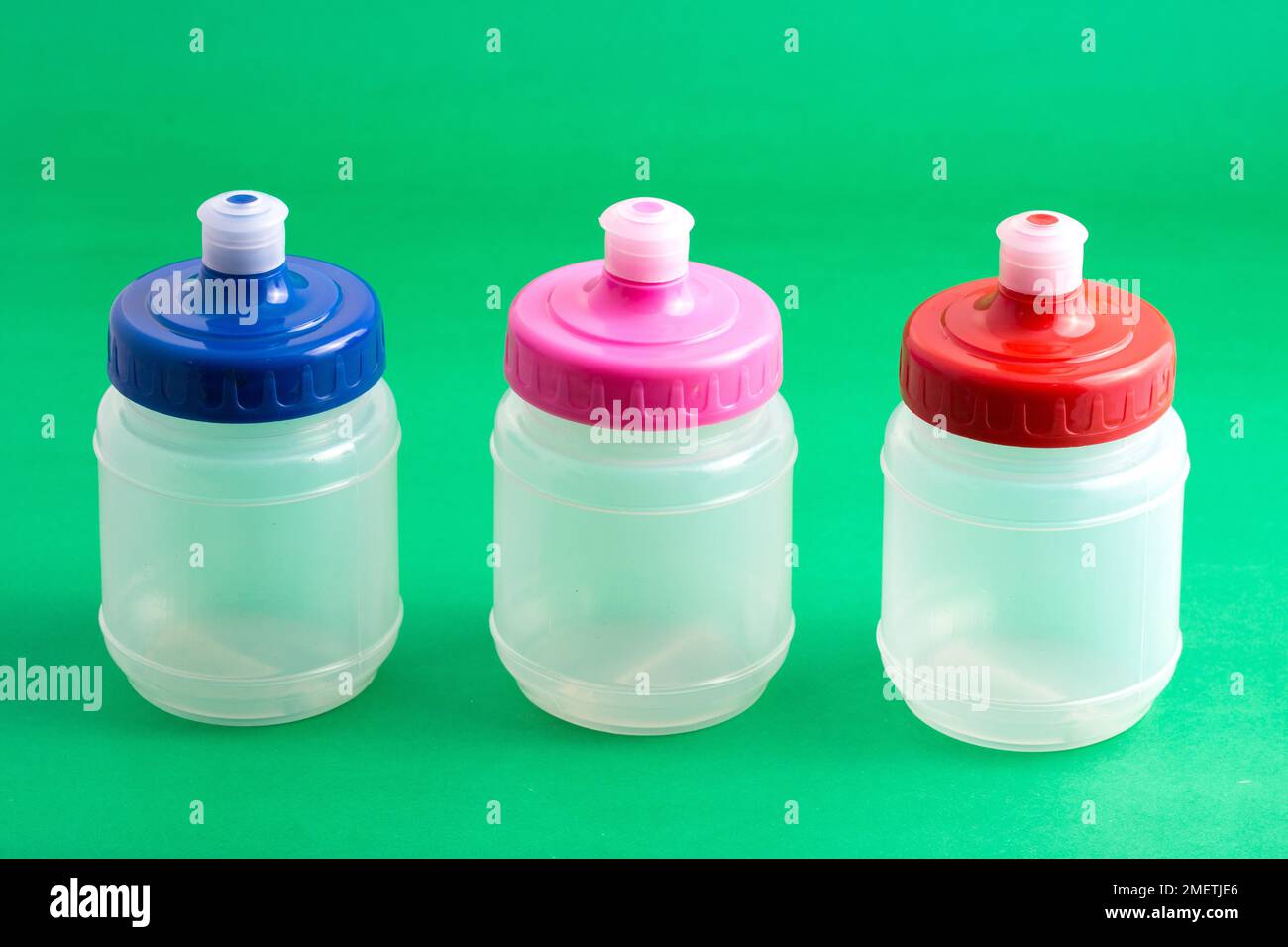 Thermos plastic sports bottles with a lid to store and transport ...