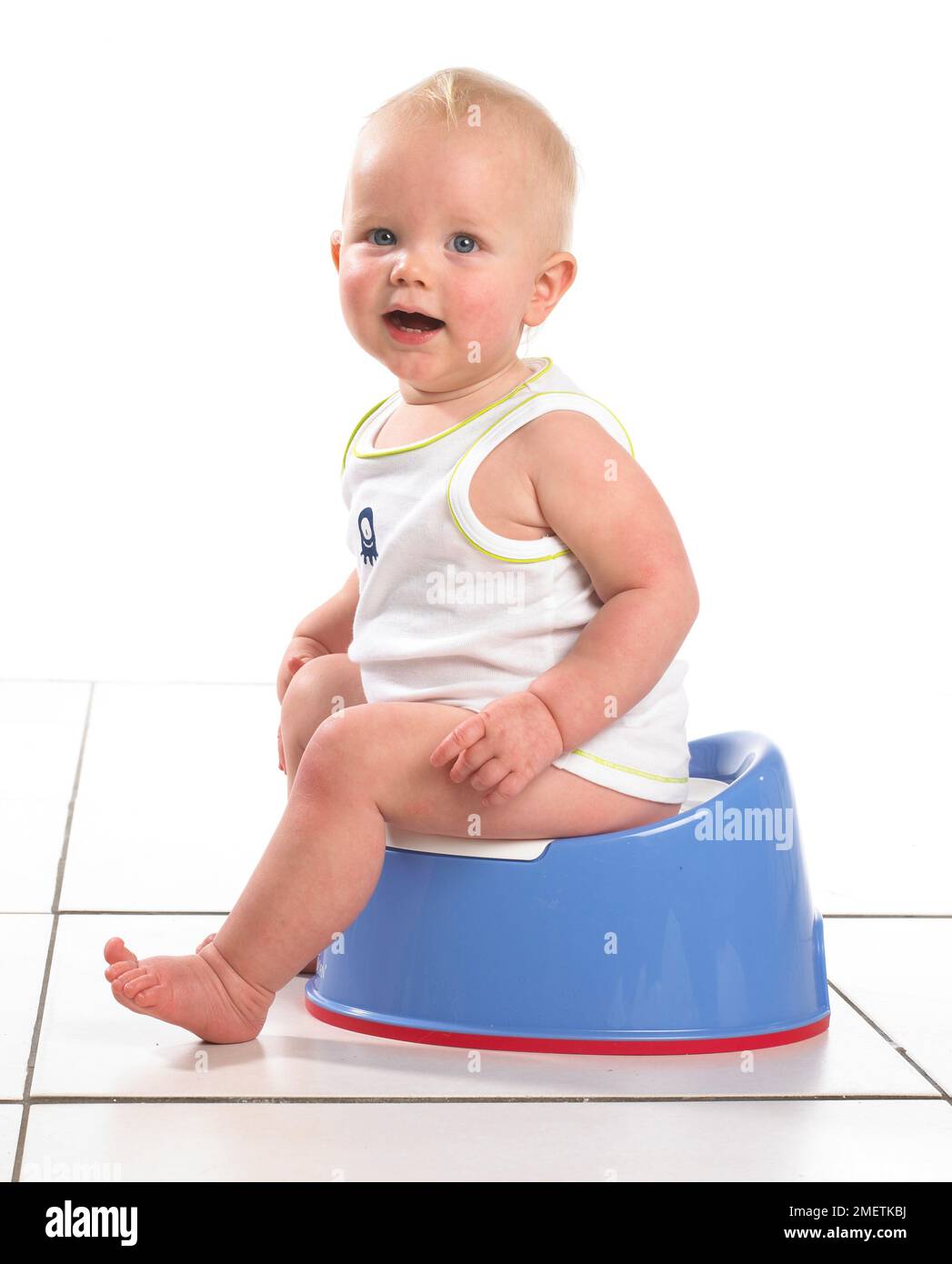 Boy wearing vest sitting on blue potty, 15 months Stock Photo - Alamy
