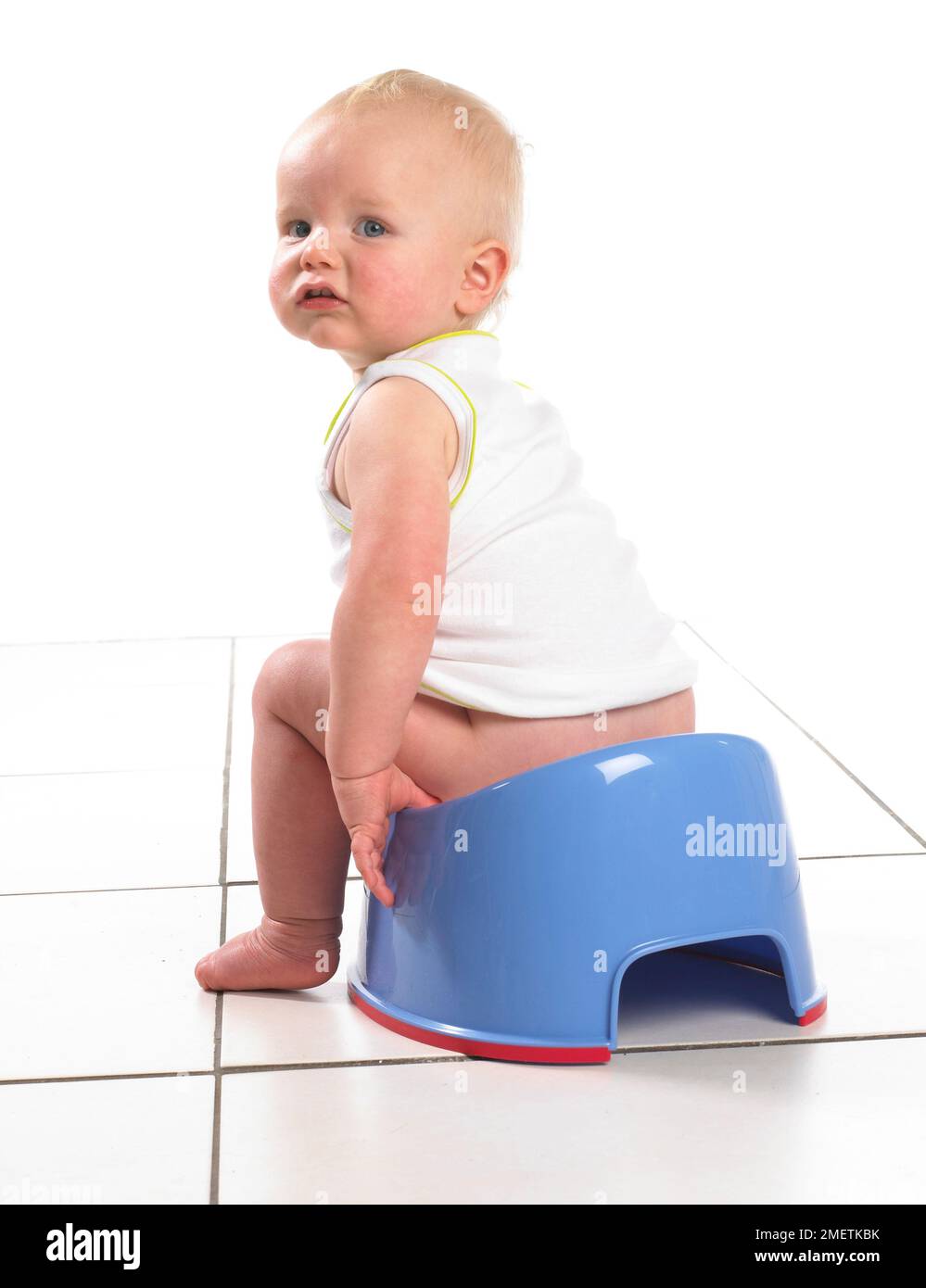 Boy wearing vest sitting on blue potty, 15 months Stock Photo - Alamy