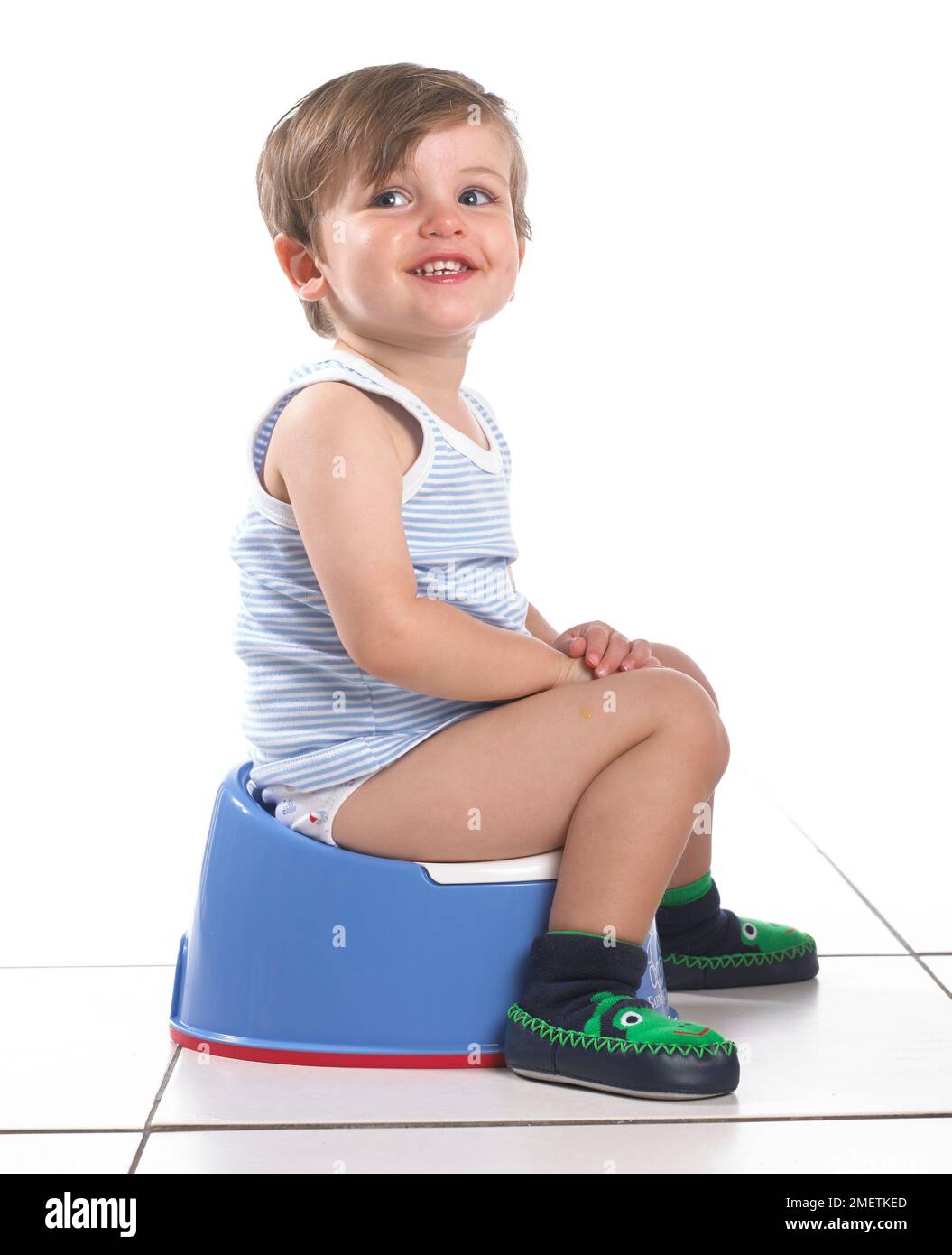 Boy sitting on a blue potty, 20 months Stock Photo - Alamy