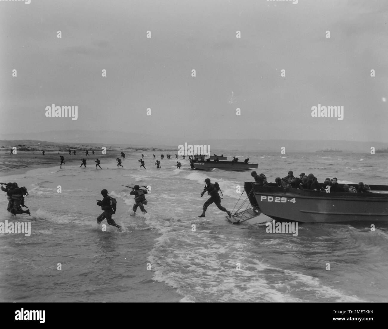 American troops are seen storming the beach during final amphibious ...