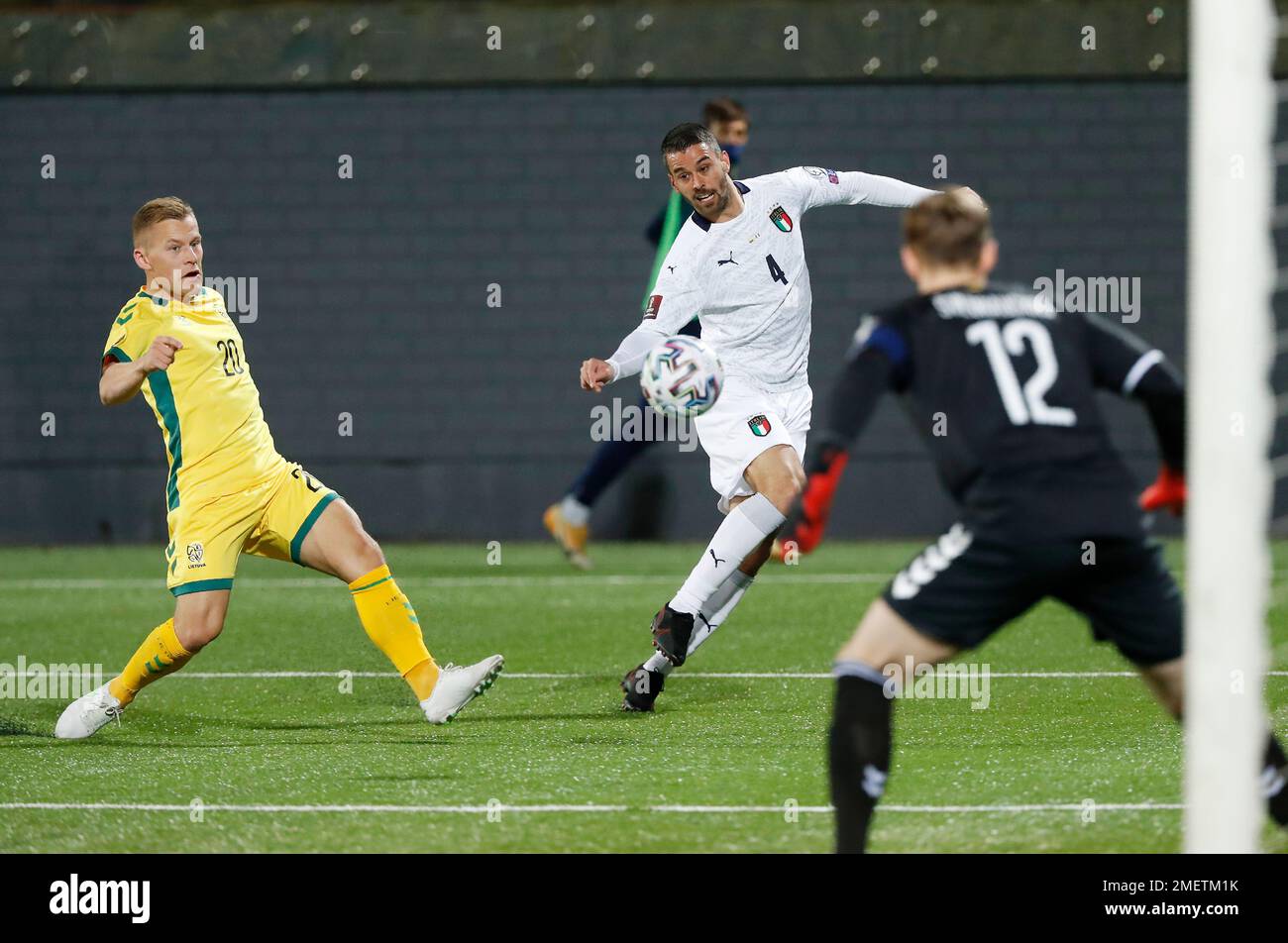 Italy's Leonardo Spinazzola, center, controls the ball as Lithuania's ...