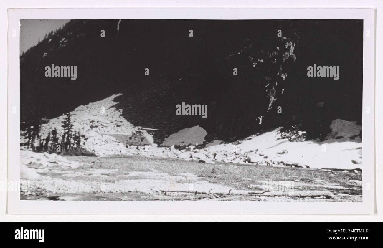 This image shows a Coast Guard rescue team performing a mountain rescue ...