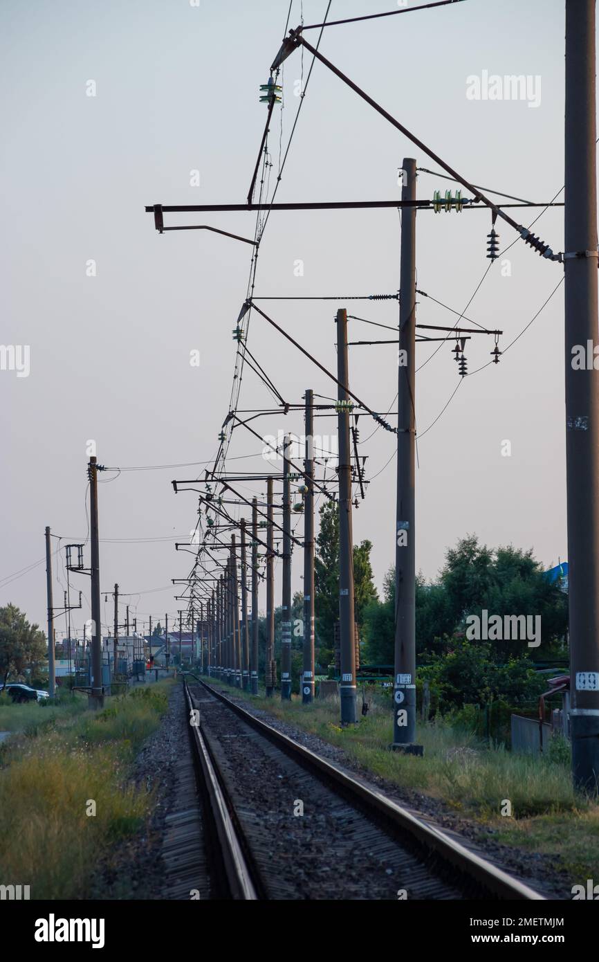 RAILWAY TRACK WITH LIGHT AND ELECTRIC POLE IN LANDSCAPE Stock Photo - Alamy