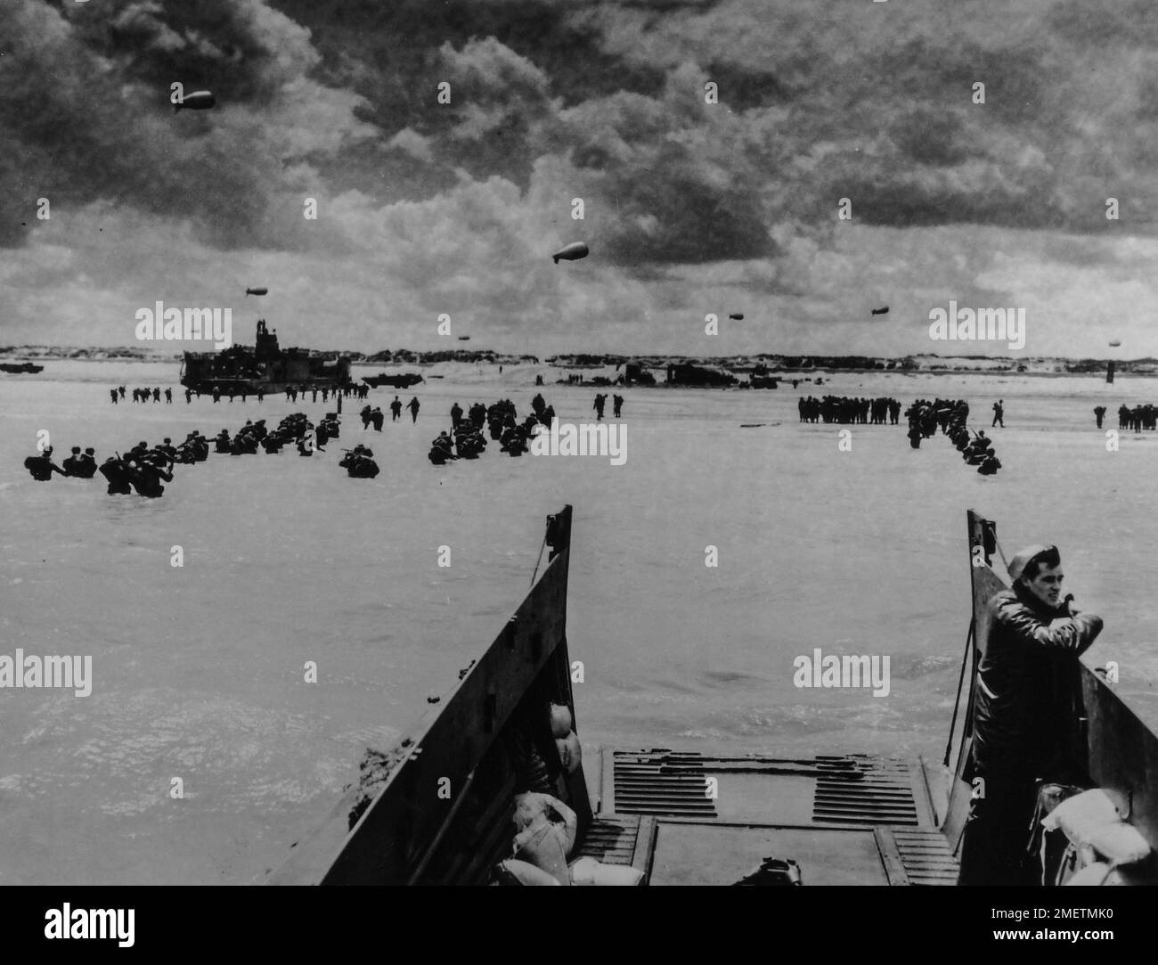 After the intense fighting of D-Day, reinforcements flow steadily ...