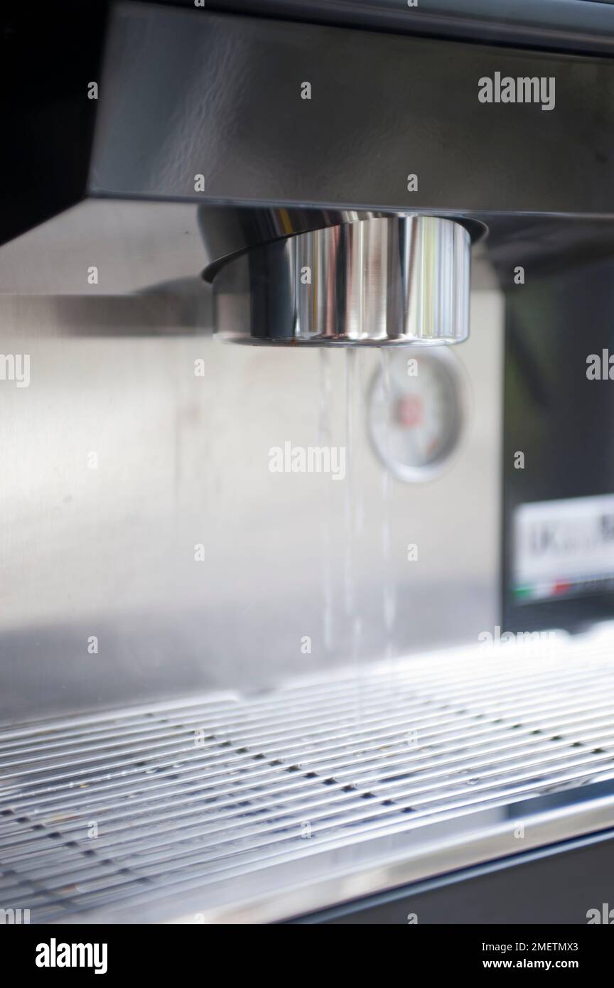 Flushing some water through group head of espresso machine Stock Photo ...