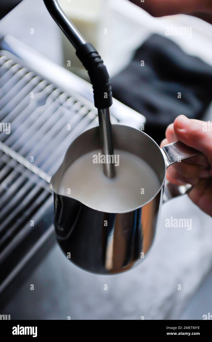 Steaming milk, step 8 Stock Photo - Alamy
