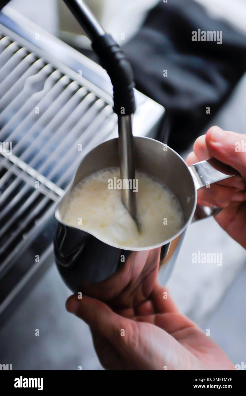 Steaming milk, step 5 Stock Photo - Alamy