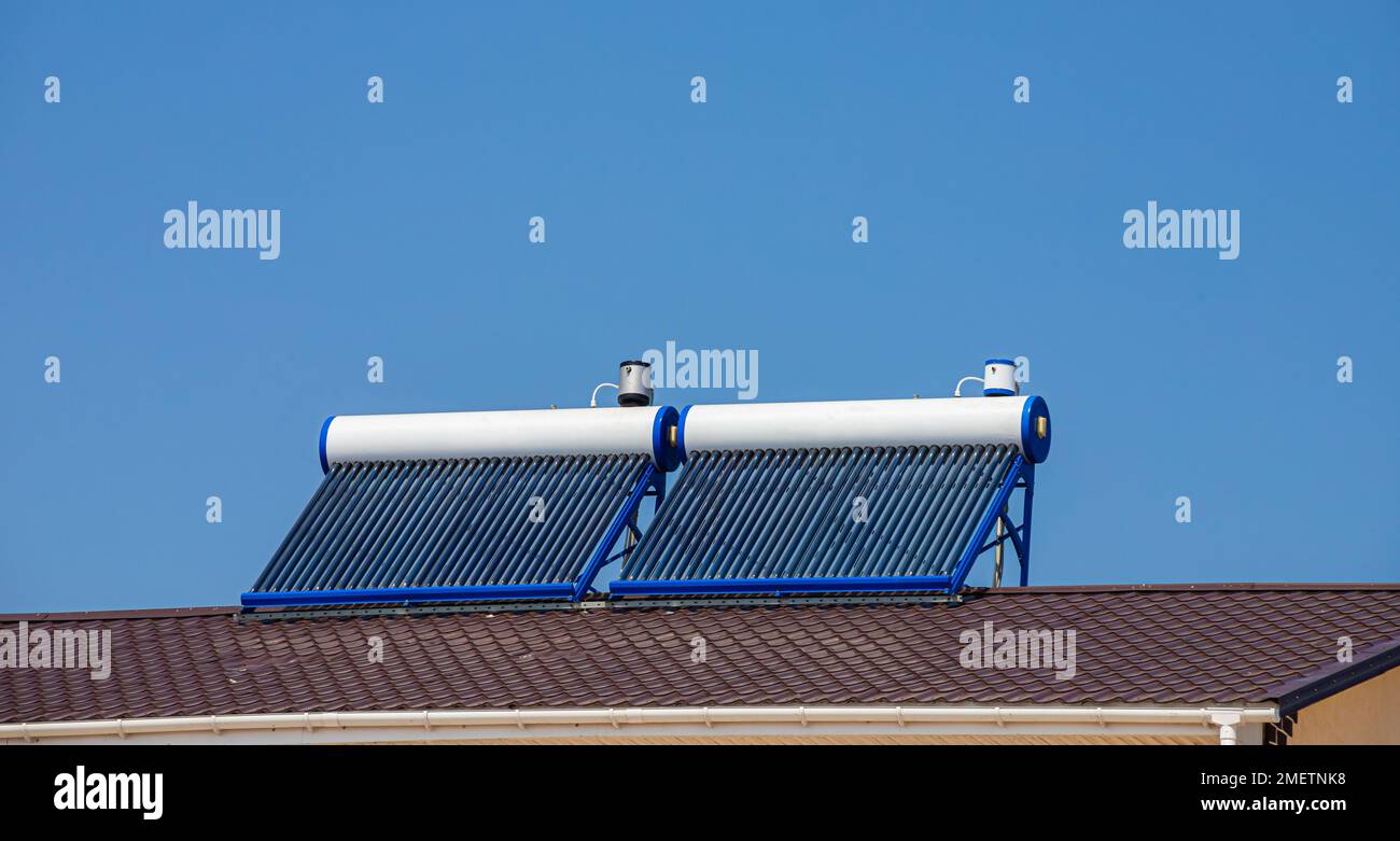 Solar water heater on roof top, beautiful blue sky background Stock ...