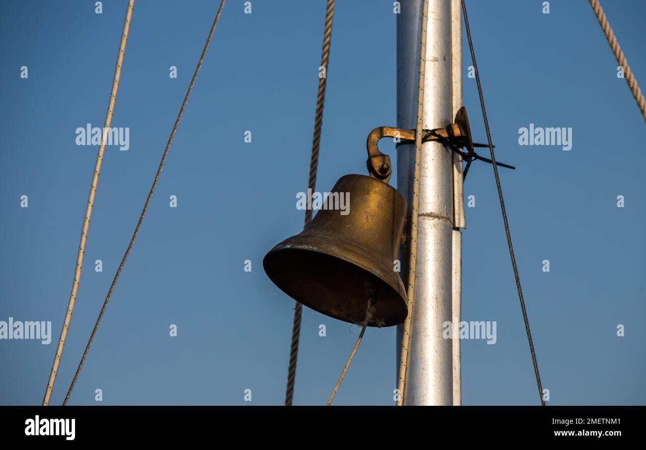 Large ship's bell with large clapper on a cruise ship at blue sky Stock ...