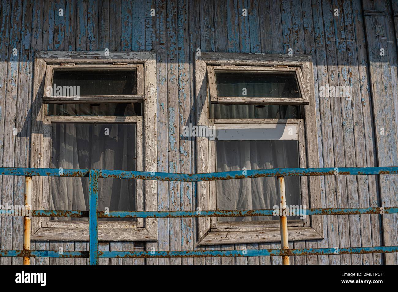 The window of the old wooden log house on the background of wooden ...