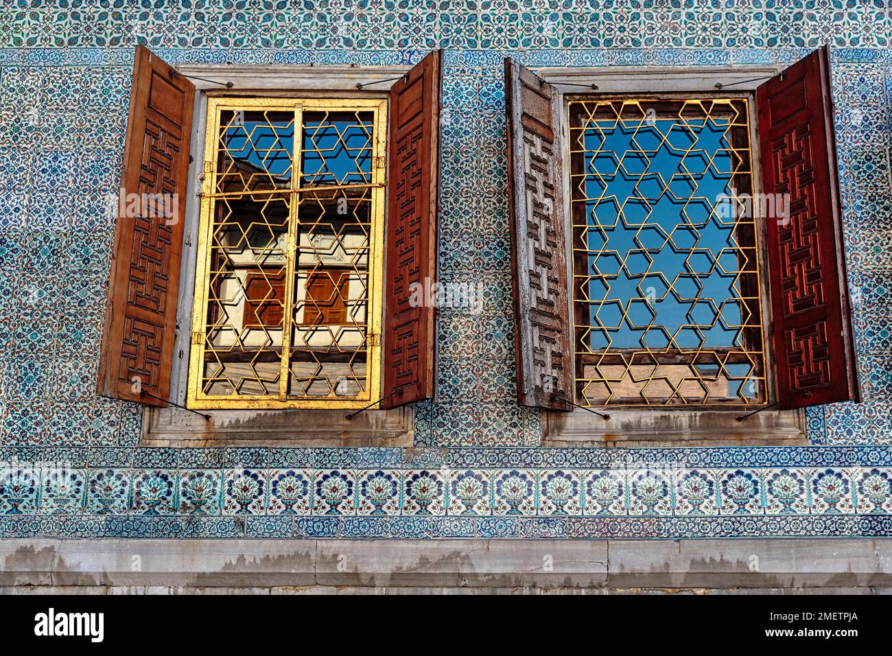 Two barred windows with shutters in mosaic wall, Topkapi Palace ...