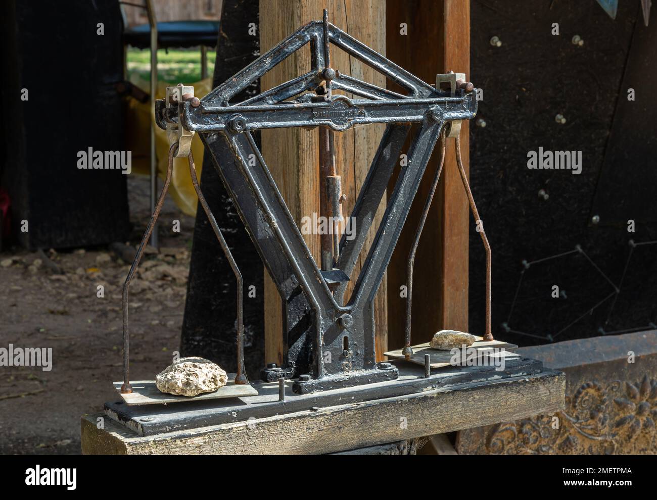 weighing of tin ore by ancient scales, originally simple balances Stock Photo - Alamy