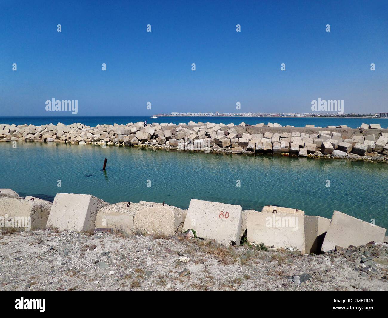 Concrete block dam. Water intake channel for the desalination of sea ...