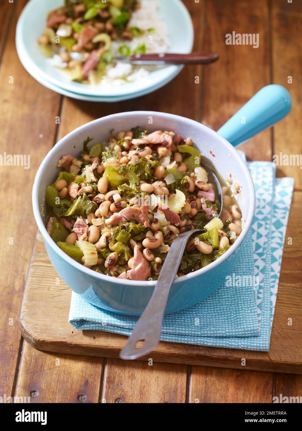 Hoppin' John, spicy jalapeno, shredded kale, beans and bacon, served ...