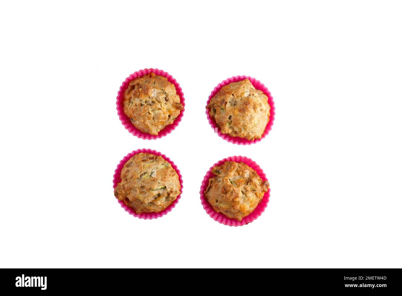 Four muffins in cases Stock Photo - Alamy