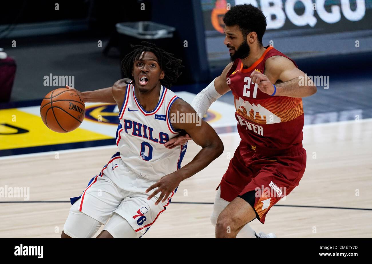 Philadelphia 76ers guard Tyrese Maxey, left, drives to the rim as ...
