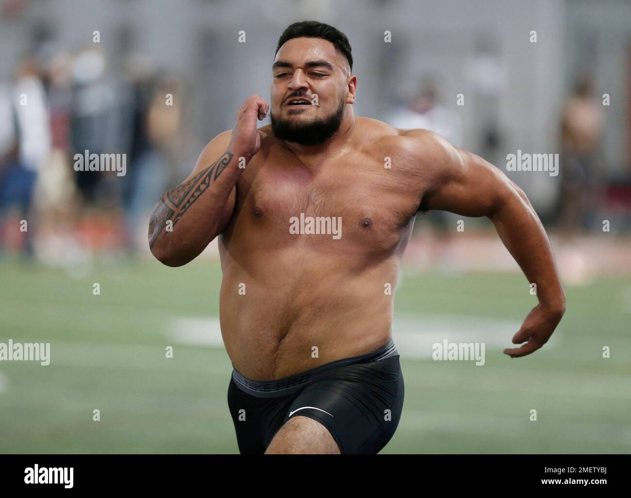 Ohio State defensive tackle Tommy Togiai runs the 40 yard dash during ...