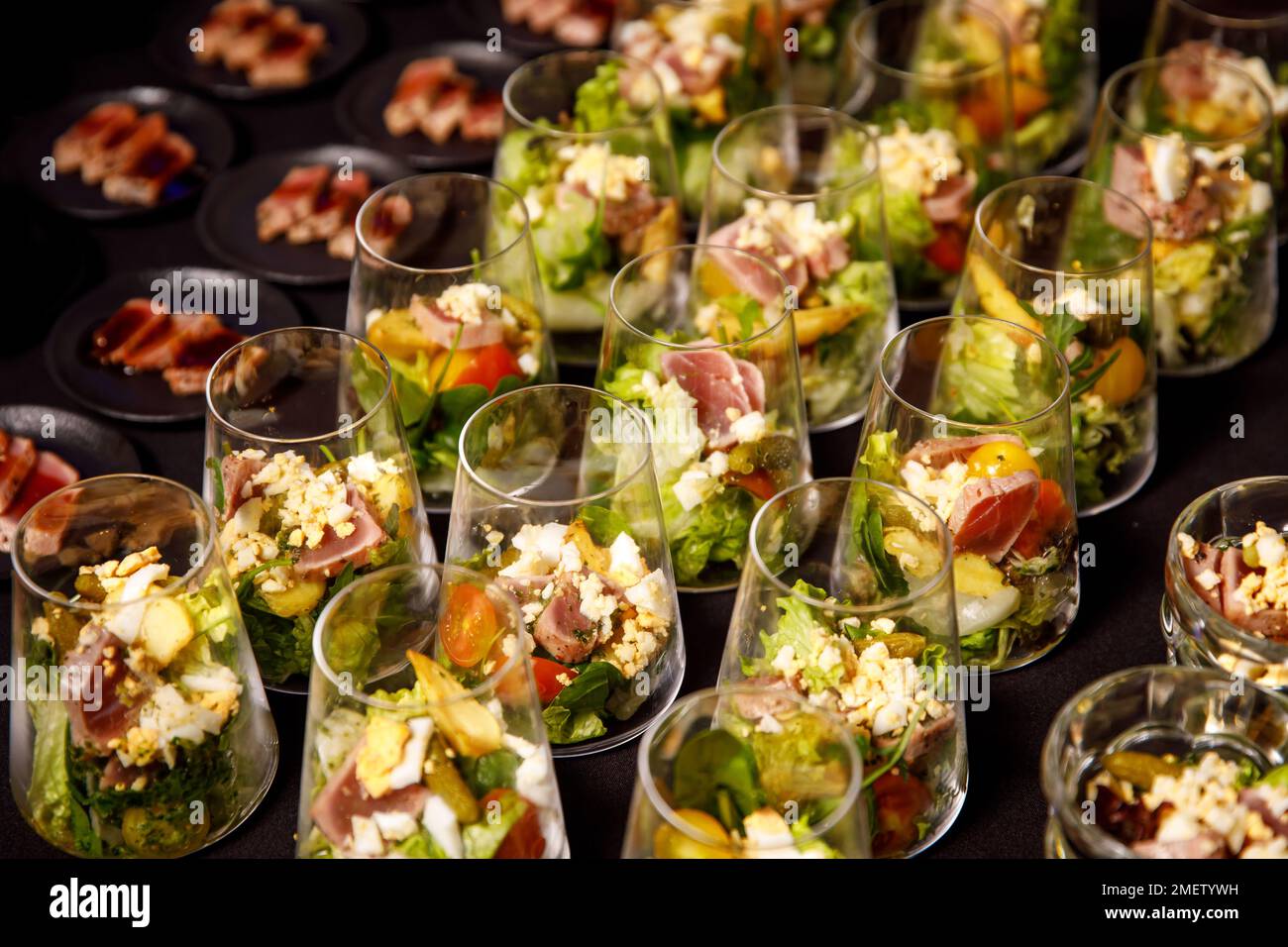 Catering concept. Salads in glasses. Assortment of snacks on the buffet ...