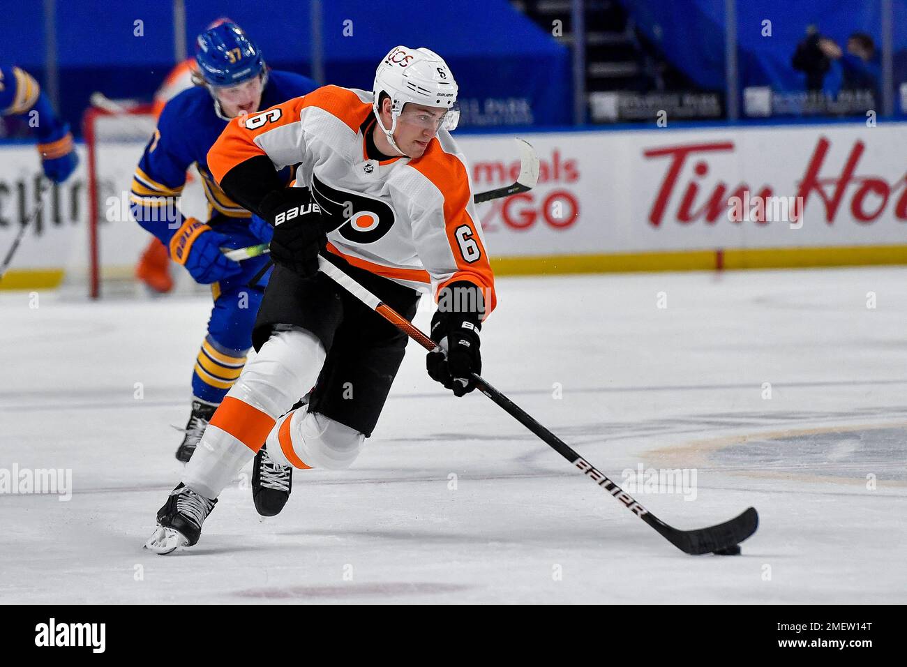 Philadelphia Flyers defenseman Travis Sanheim (6) skates with the puck ...