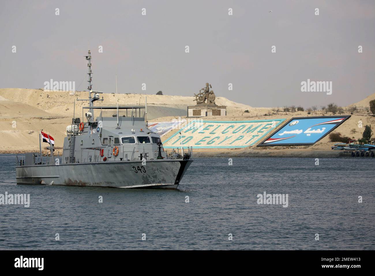 A cargo ship sails through the town of Ismailia, Egypt, Tuesday, March 30, 2021 as traffic ...