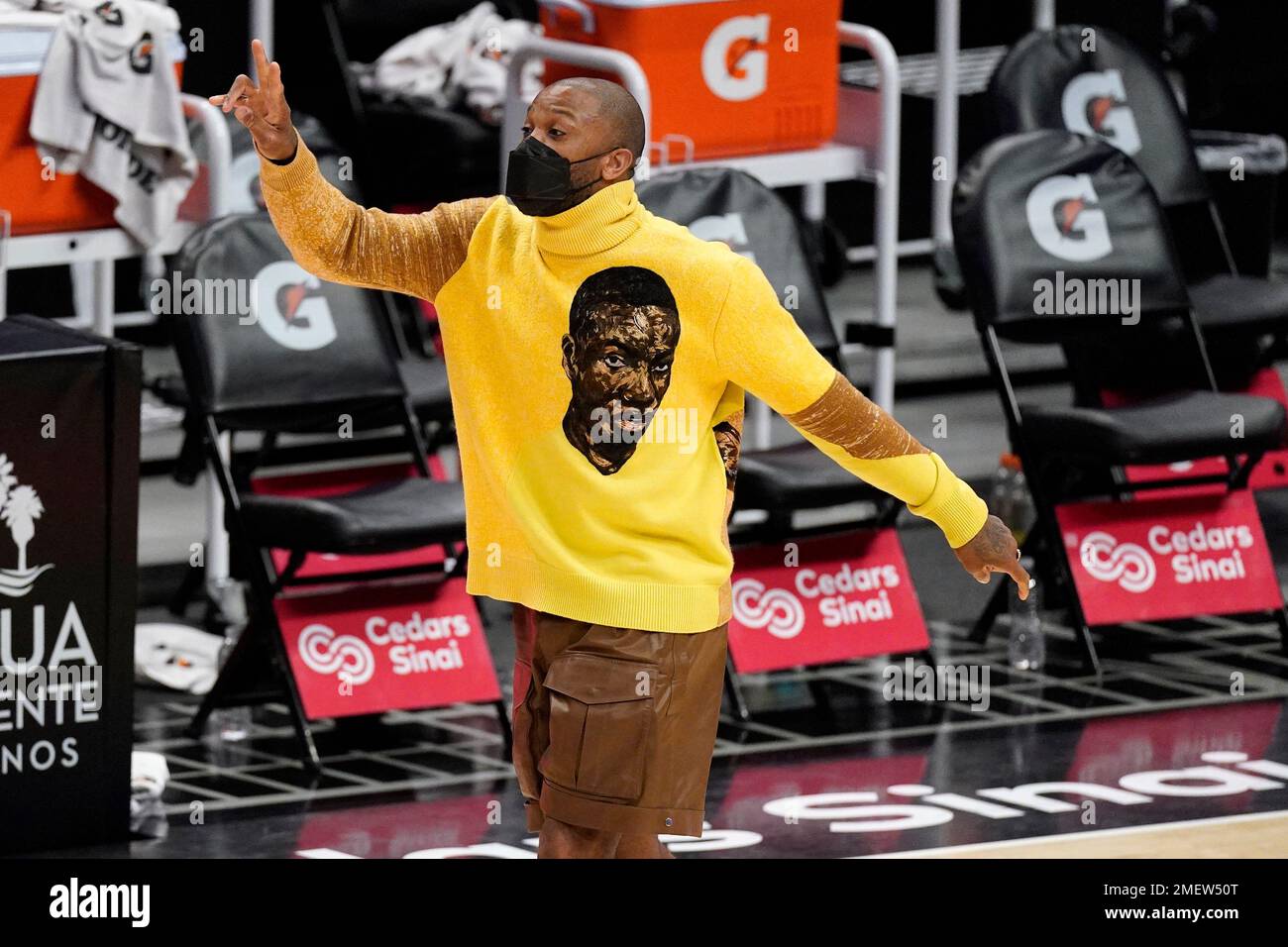 Milwaukee Bucks' P.J. Tucker, left, gestures after an NBA basketball ...