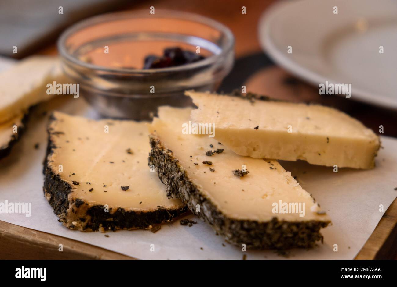 Sicilian fresh organic black pecorino cheese Stock Photo - Alamy