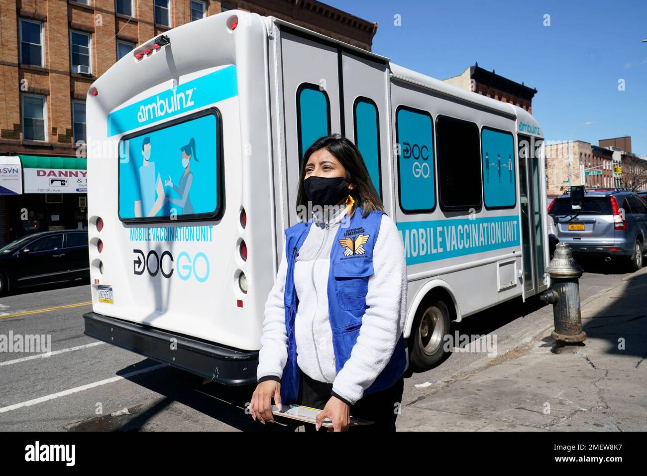 Mixteca community organizer Nicole Rojas waits beside a mobile ...