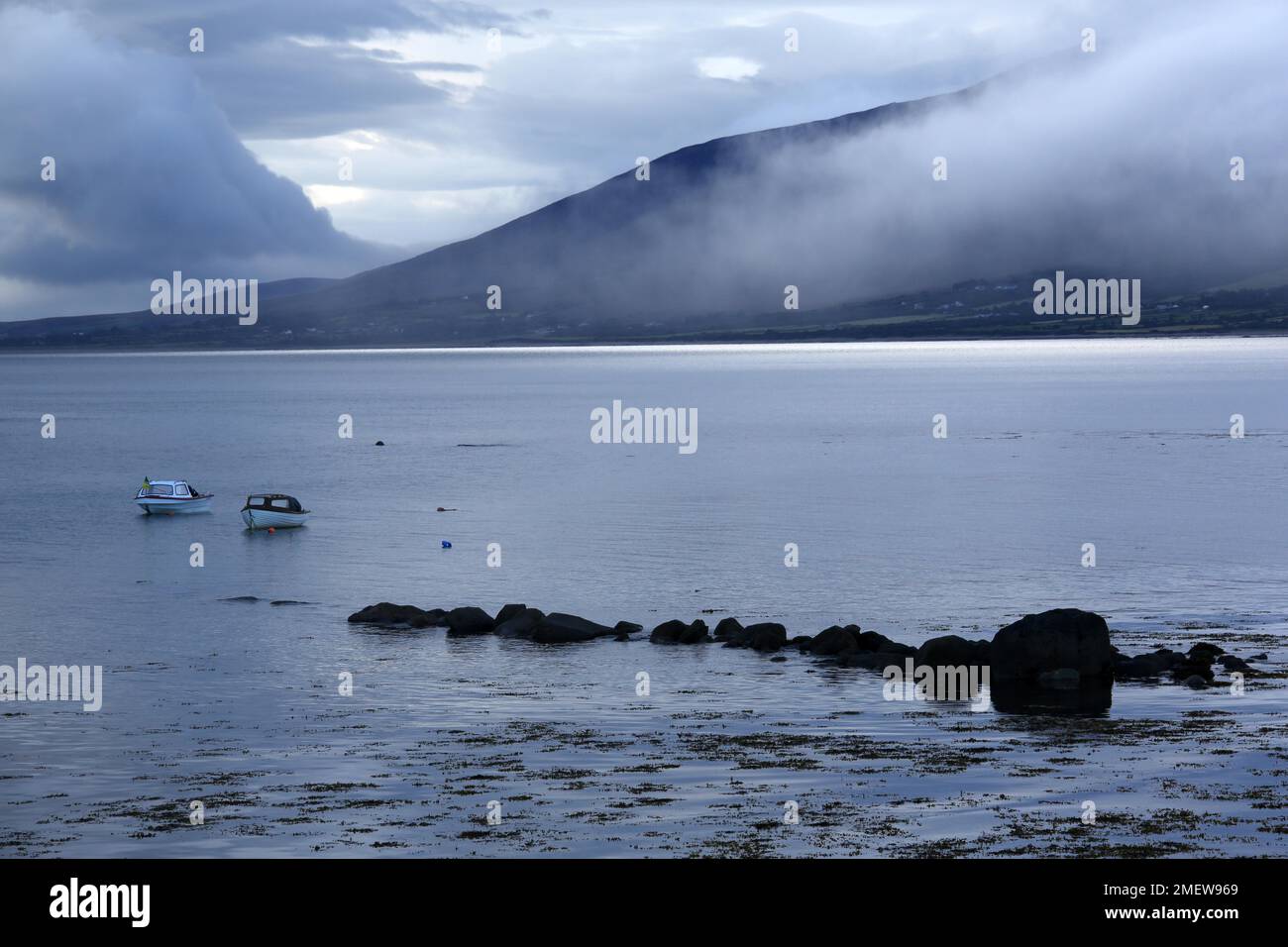 Boats in bay in beautiful Irish light along Wild Atlantic Way. County ...