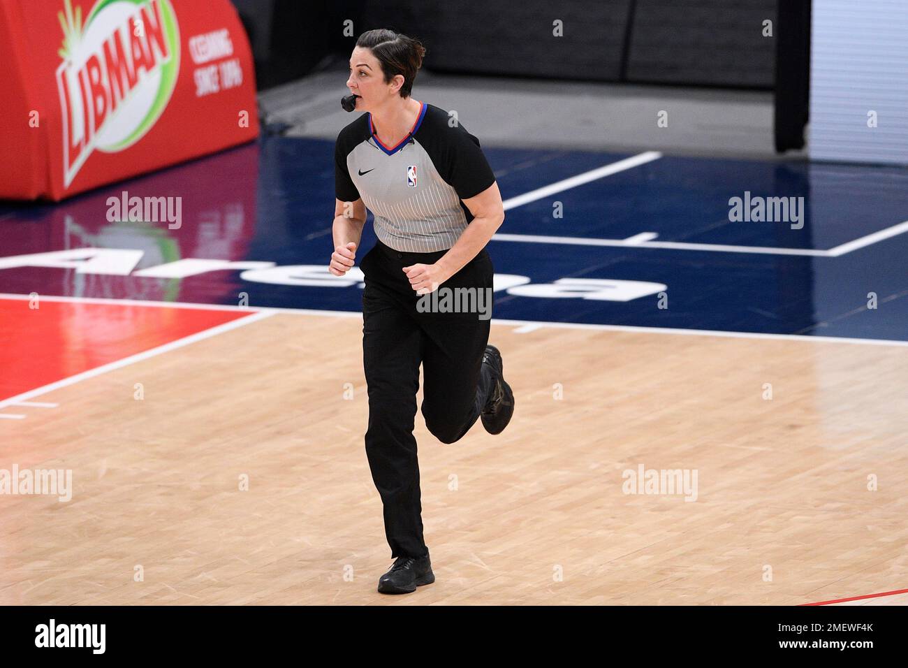 Referee Lauren Holtkamp runs on the court during the second half of an ...