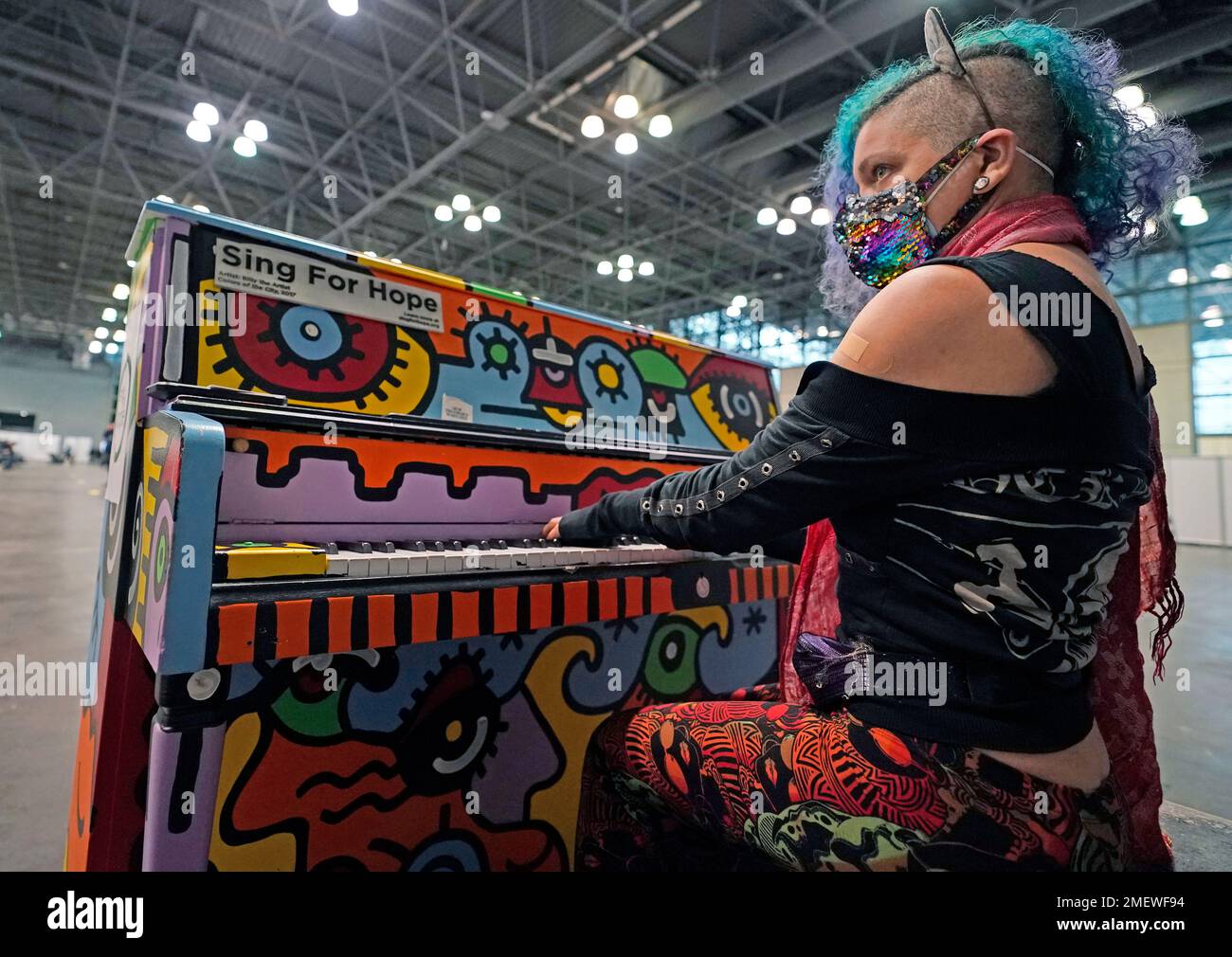 A bandage on her vaccinated arm, Amy Hope, more known as "Gravity," the ...