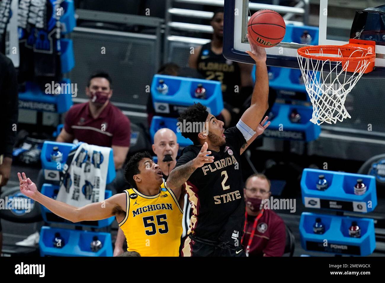 Florida State guard Anthony Polite shoots ahead of Michigan guard Eli ...