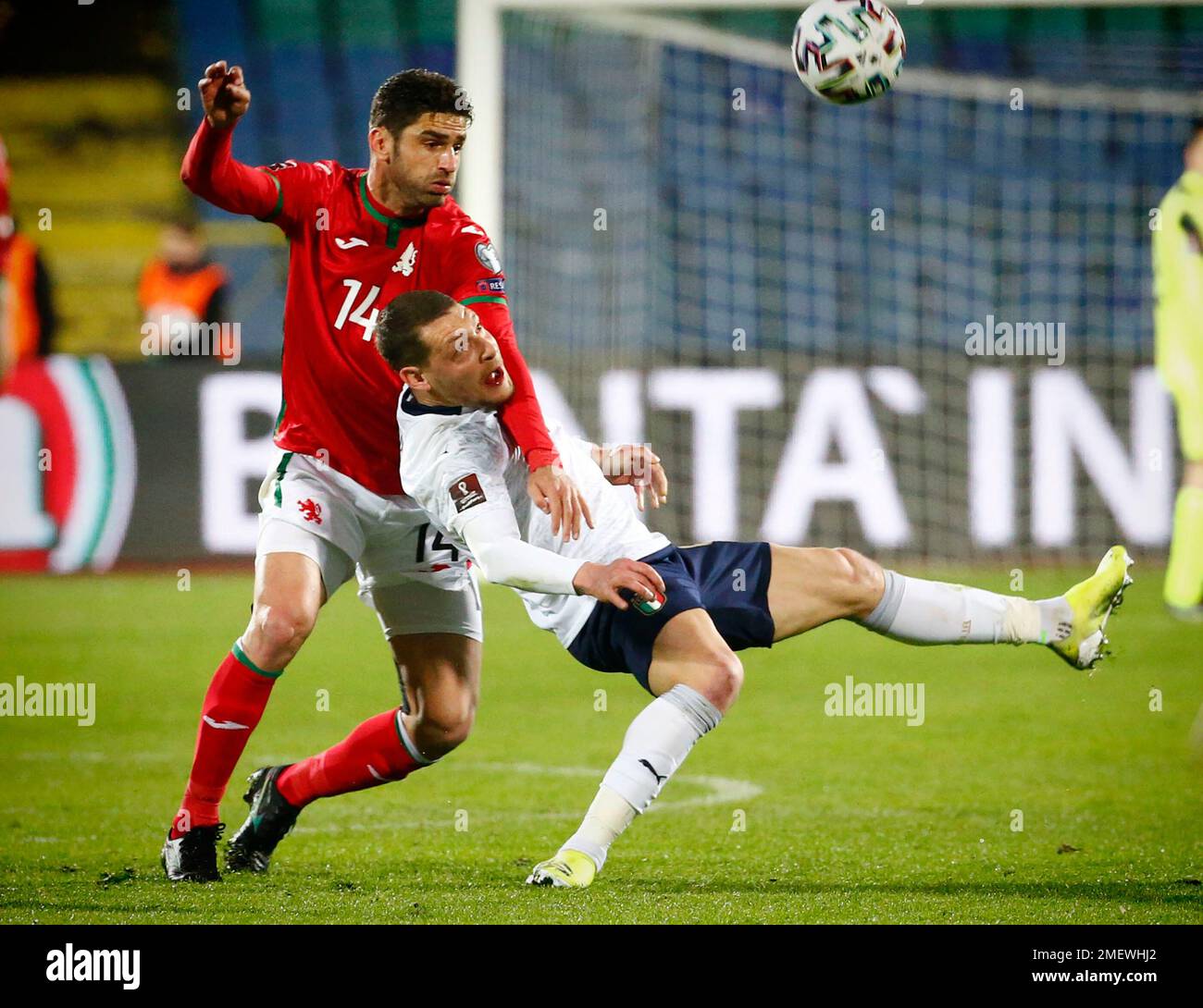 Bulgaria's Daniel Dimov, left, challenges Italy's Andrea Belotti, right ...