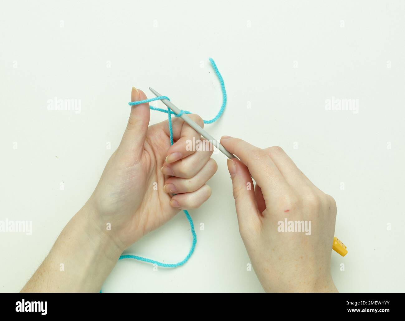 Steps for casting on knitting Stock Photo - Alamy