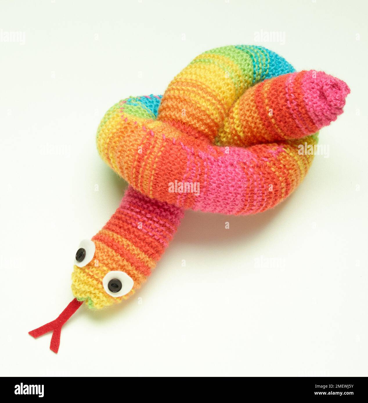 Steps to making snake in self-striped yarn Stock Photo - Alamy