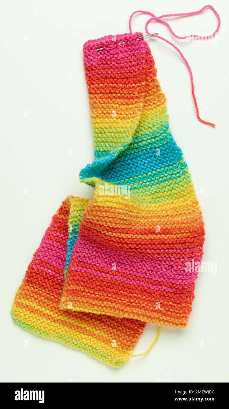 Steps to making snake in self-striped yarn Stock Photo - Alamy