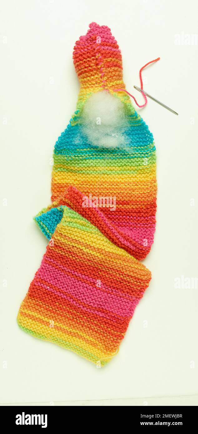 Steps to making snake in self-striped yarn Stock Photo - Alamy