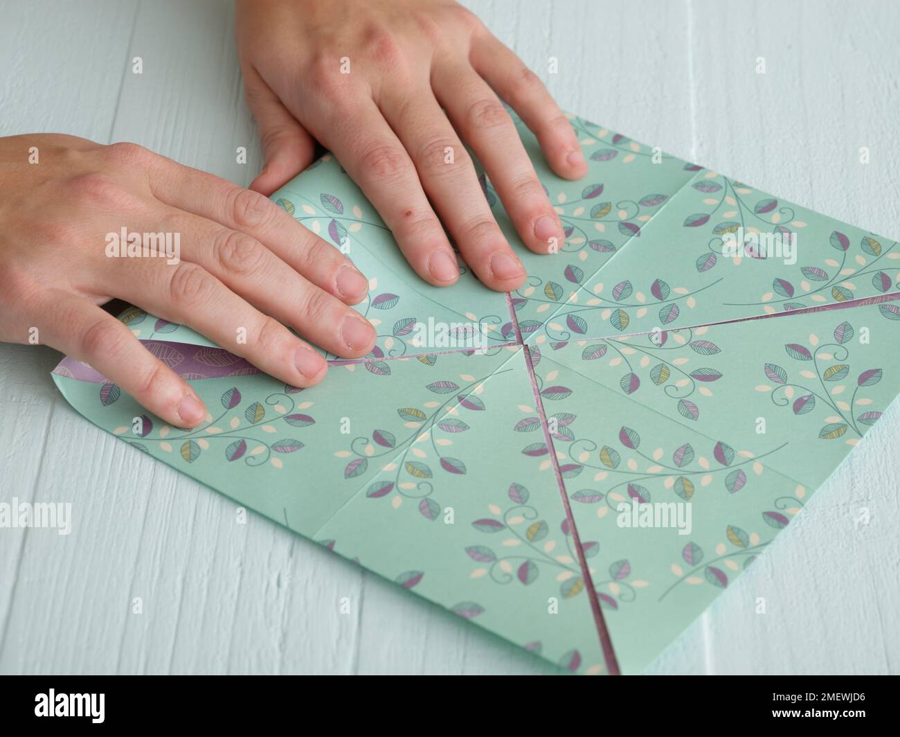 Paper Craft. DIY Origami Gift box Step 4 Stock Photo - Alamy