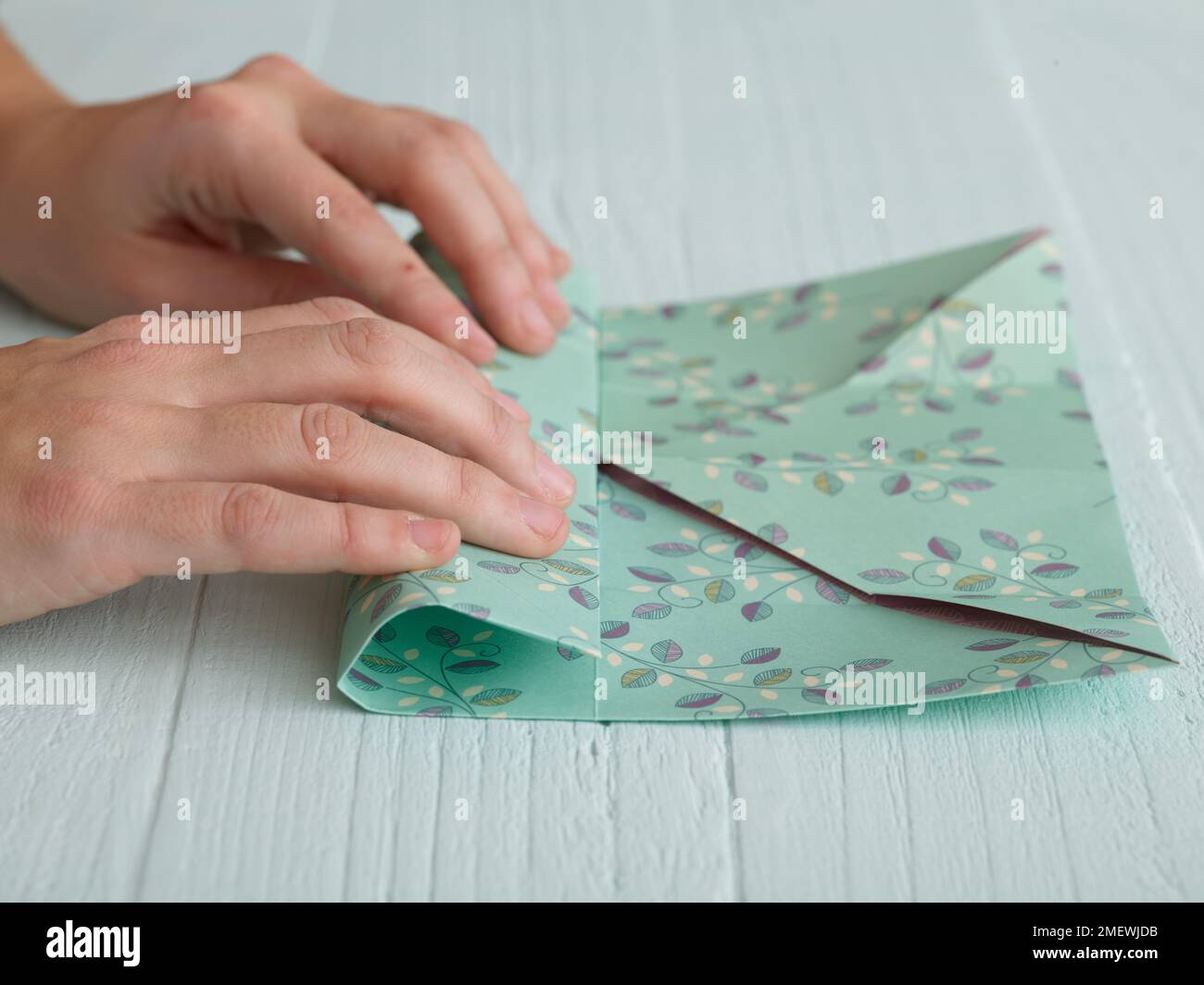 Paper Craft. DIY Origami Gift box Step 5 Stock Photo - Alamy
