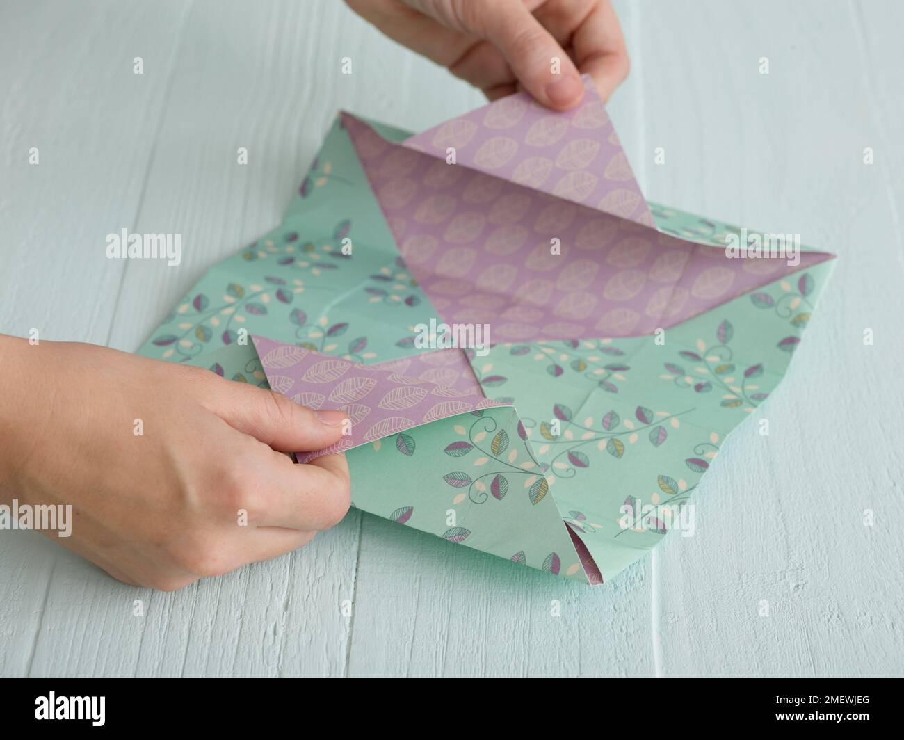 Paper Craft. DIY Origami Gift box Step 7 Stock Photo - Alamy